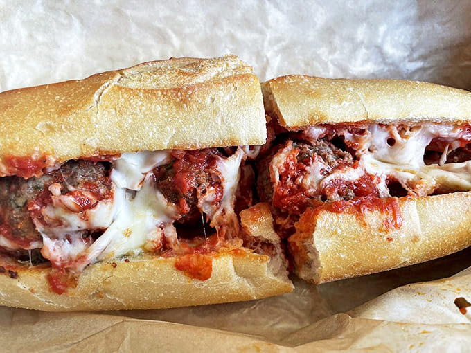 The meatball sub features handmade meatballs swimming in marinara and melted cheese – a two-handed affair worth every napkin you'll need.