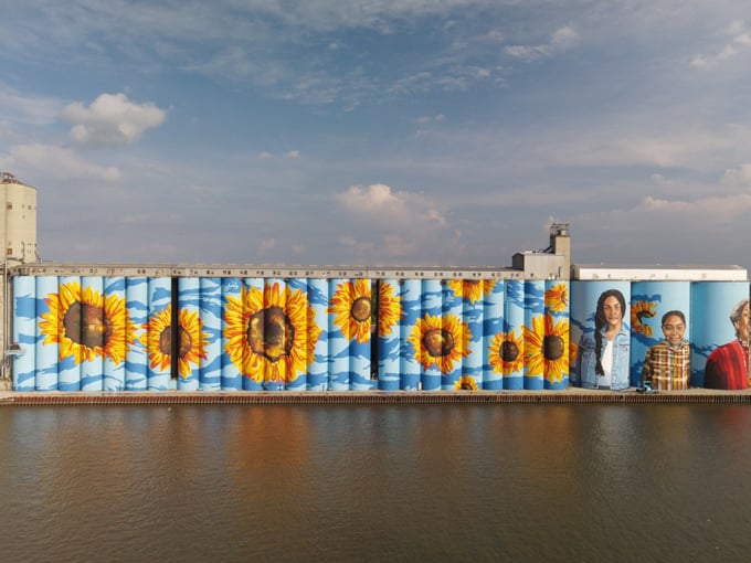 Toledo's riverfront has been reimagined through this monumental artwork, drawing visitors who come for the mural but stay to explore the neighborhood.