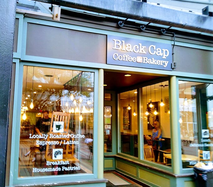 The green storefront and glowing windows feel like a warm hug on a chilly Vermont morning.