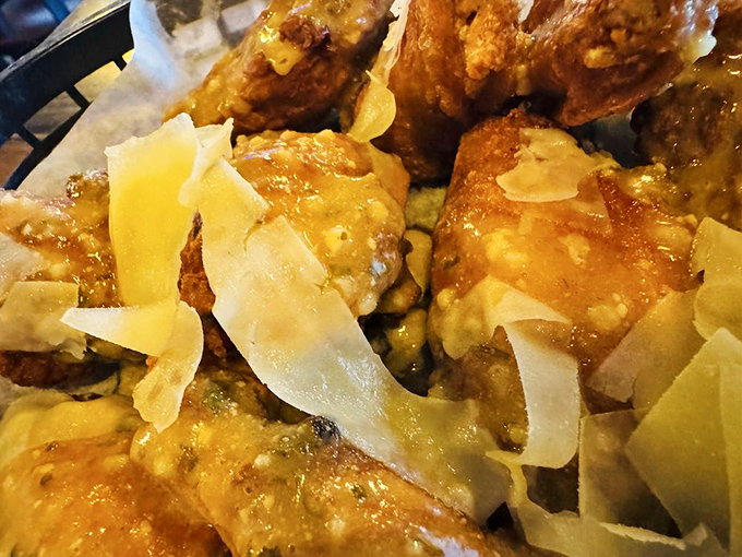 Garlic parmesan wings arrive showered with cheese shavings &ndash; a sophisticated twist on the classic pub snack that pairs perfectly with cold beer.