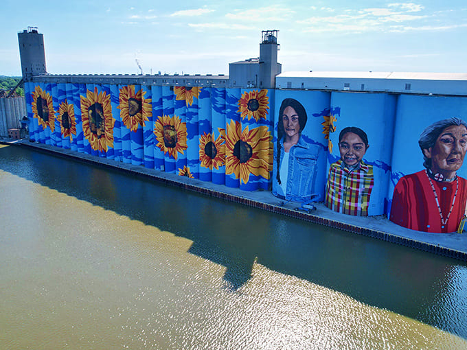 Bird's-eye perspective shows how the mural anchors the entire riverfront area, visible from practically everywhere in downtown Toledo.