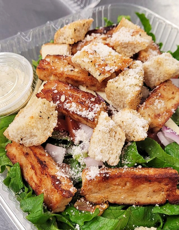 Fresh greens, house-made croutons, and perfectly grilled chicken prove that even salads get the gourmet treatment at this unassuming spot.
