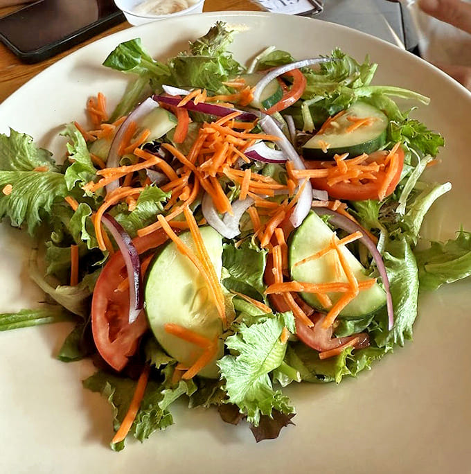 Fresh vegetables piled high on crisp lettuce remind you that not everything needs to be fried to be delicious.