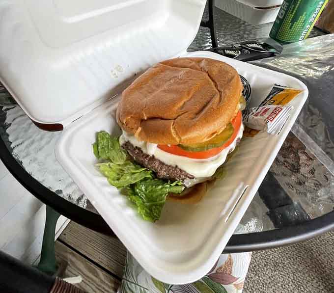 This double cheeseburger deluxe stacked with fresh veggies shows Hazel's doesn't skimp on the good stuff.