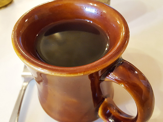 Coffee served in a proper brown mug, because some traditions exist for a reason and that reason is deliciousness.
