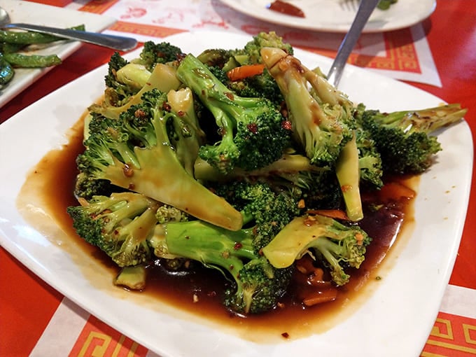 Broccoli with garlic sauce shows off vibrant green florets in a glossy coating that makes eating your vegetables feel like a genuine treat.