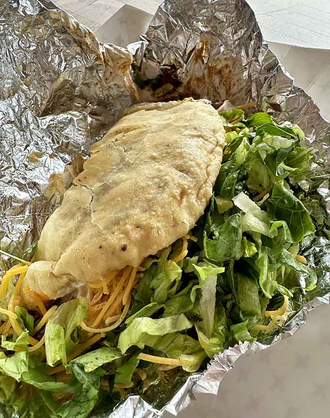 The taco salad arrives as a mountain of fresh ingredients that somehow manages to be both virtuous and completely indulgent.