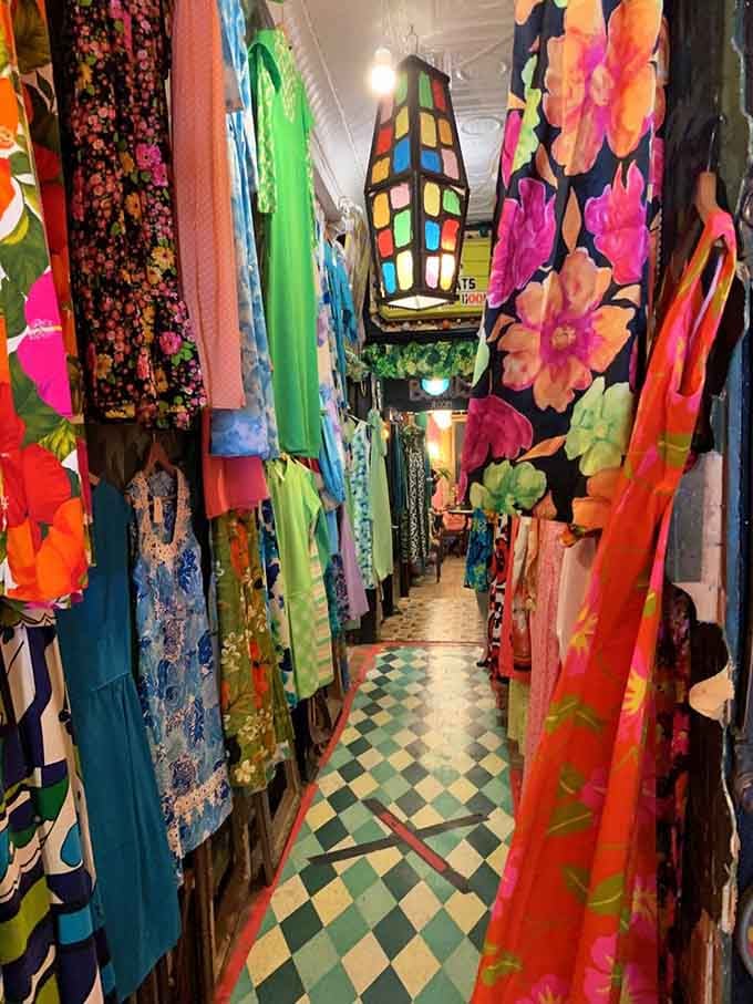 Flowing fabrics in bold prints create a tunnel of vintage fashion possibilities, where every garment tells a story about the era that created it.