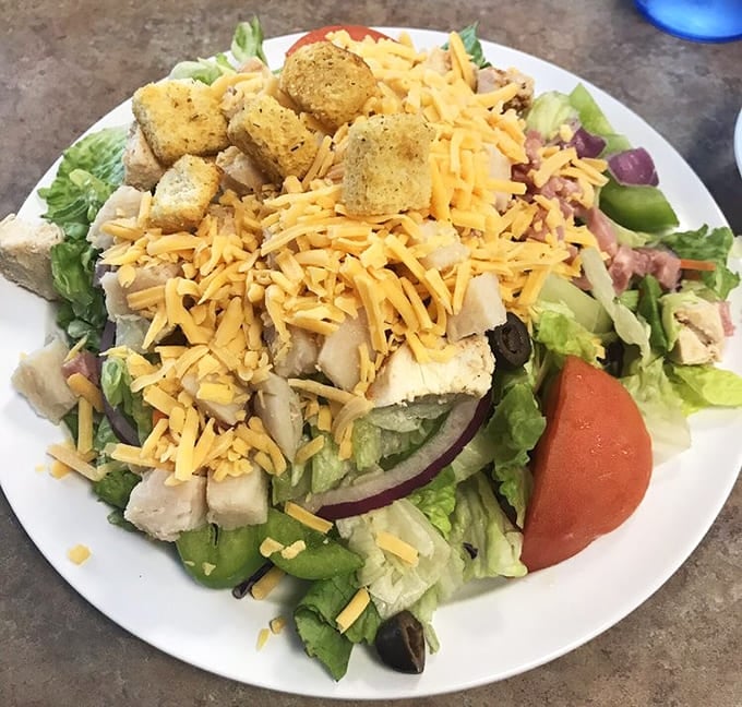 Even the salads get serious attention, loaded with toppings and proving vegetables can hold their own at this table.