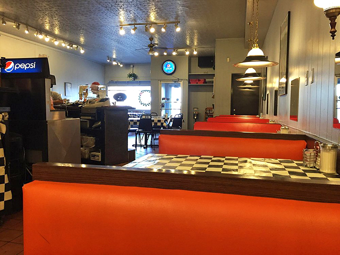 Step into a time capsule of cozy nostalgia. The checkered floor and warm lighting set the stage for culinary memories in the making.