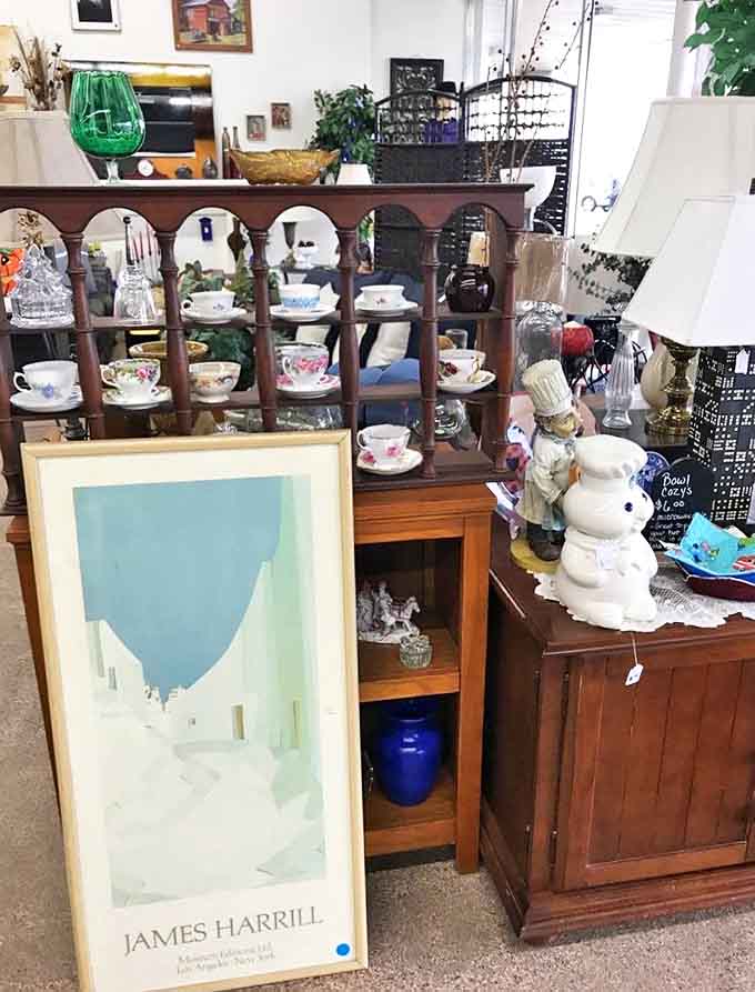 This wooden cabinet and vintage teacup collection represent the kind of craftsmanship that makes modern furniture weep with inadequacy.