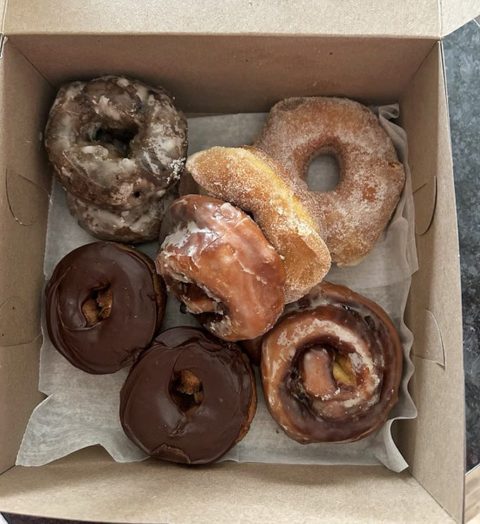 This donut assortment looks like it could solve most of life's problems, or at least make you forget about them for approximately six blissful minutes.