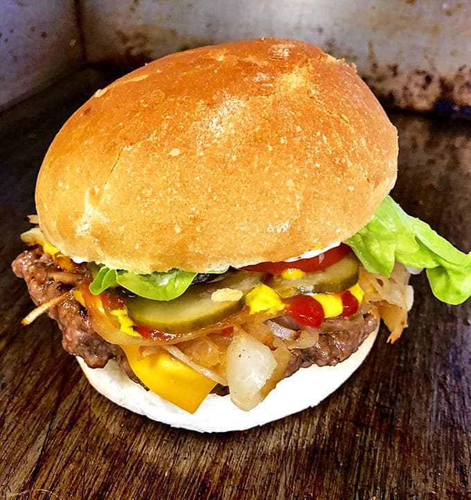 This isn't just a burger &ndash; it's an architectural marvel of beef, cheese, pickles and onions that makes taste buds stand at attention.