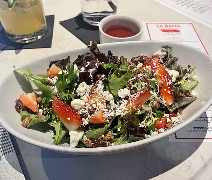 Fresh strawberries and goat cheese turn this salad into something that makes eating healthy feel like cheating.