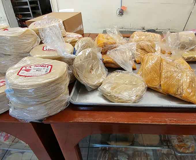 Tortillas and tamales ready for takeout, because sometimes you need to stock up like you're preparing for a delicious apocalypse.