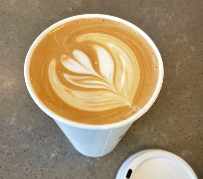 Coffee art so pretty you almost feel guilty disturbing it, though not guilty enough to stop you from that first satisfying sip.