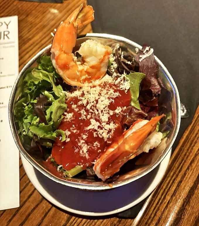 Jumbo shrimp cocktail perched atop fresh greens &ndash; the seafood selection here rivals any coastal restaurant's offerings.