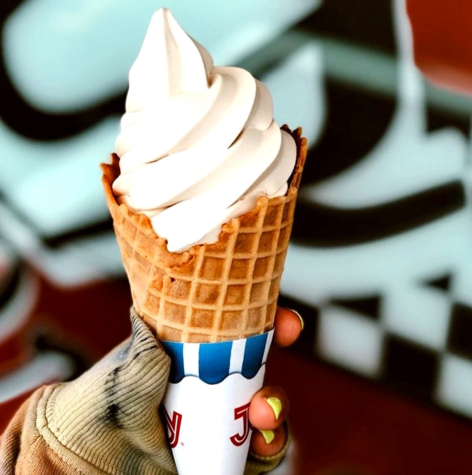 Soft serve perfection in a waffle cone &ndash; Al's ice cream swirls high with creamy vanilla goodness.