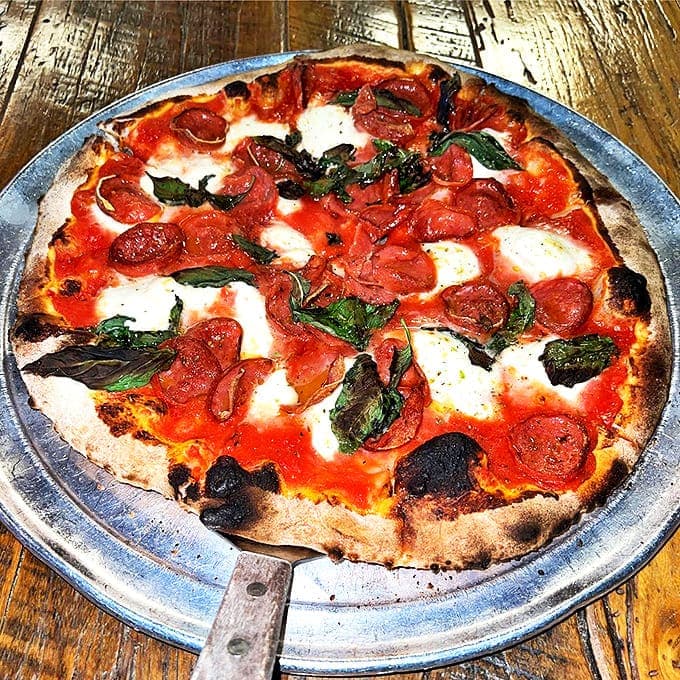 Margherita with pepperoni: Traditional Margherita gets an American handshake with perfectly cupped pepperoni that crisp at the edges. It's the best of both worlds.