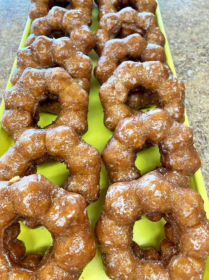 Mochi donuts bubbling in hot oil showcase the craftsmanship behind these treats &ndash; each one carefully monitored for that perfect golden hue.
