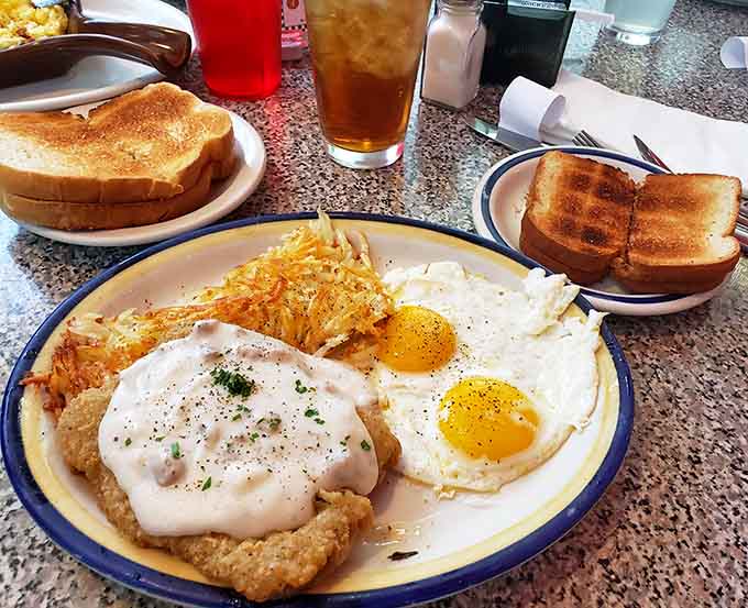 Country fried steak with eggs and hash browns delivers the kind of hearty breakfast that fuels adventures, or at least a good nap.