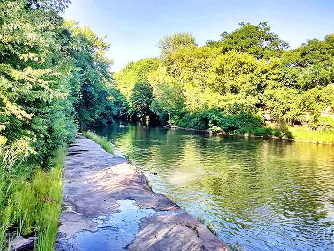 The serene Mahoning River winds through town like a liquid timeline, reflecting centuries of stories along its peaceful banks.