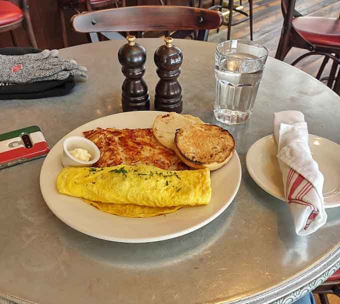 A fluffy omelet with golden hash browns proves that breakfast done right is worth waking up for any time.