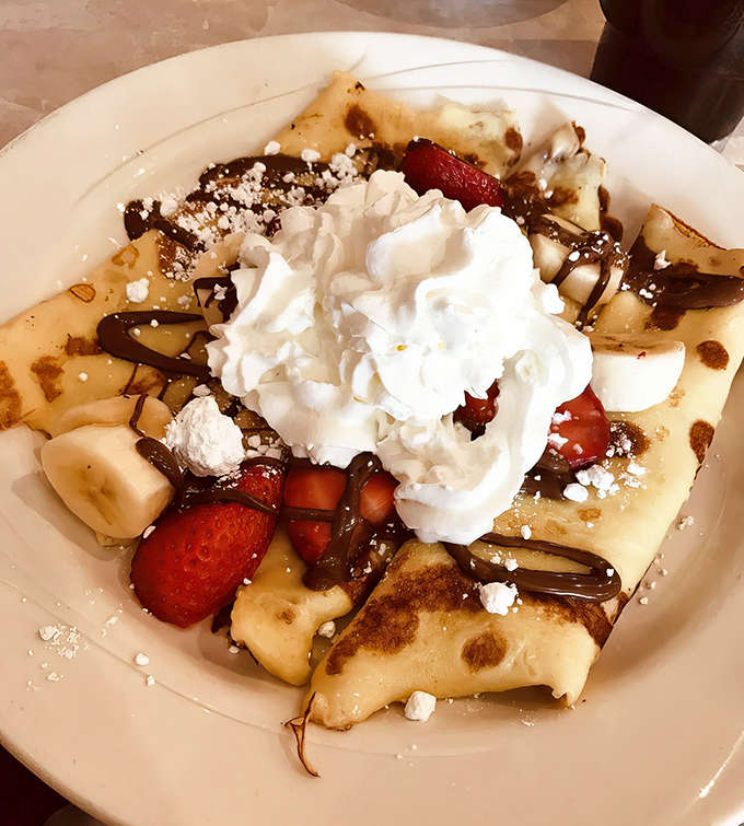 This Nutella crepe situation is basically a love letter to anyone who believes breakfast should involve chocolate and zero regrets whatsoever.