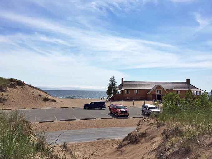 Even the approach to paradise is scenic, with dunes rising beyond the lot like nature's welcome committee.