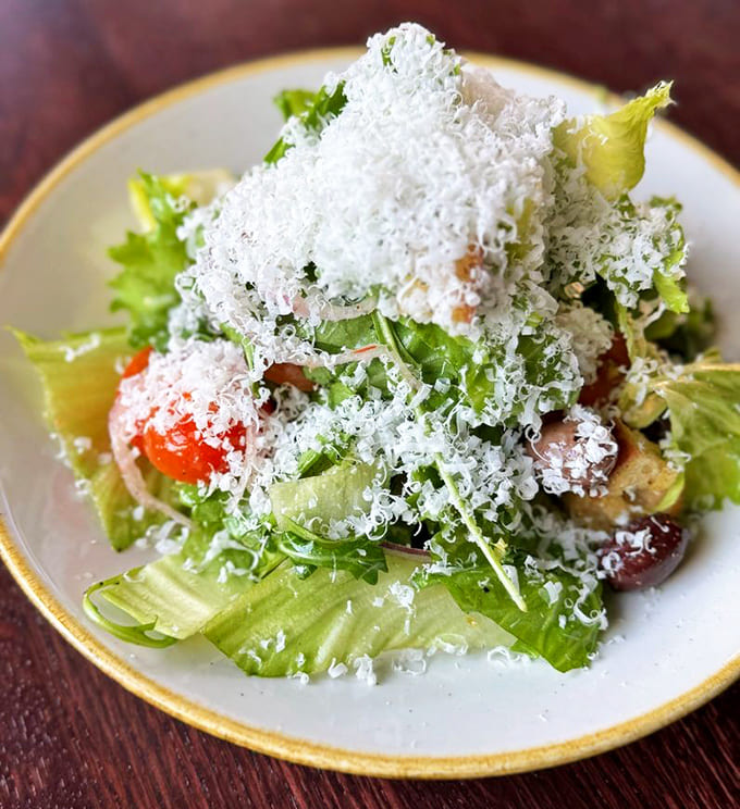 This salad wears its Parmesan like a winter coat, generous and glorious in ways salads rarely achieve.