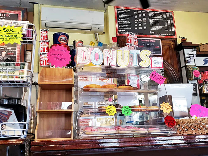 Fresh-baked donuts behind glass promise the perfect companion to your morning coffee or afternoon popcorn break.