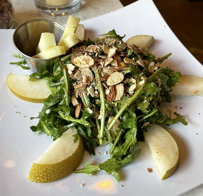 Pear Salad: Not just a token vegetable offering &ndash; this artful arrangement of greens, pear slices, and nuts proves salads can be both virtuous and delicious.