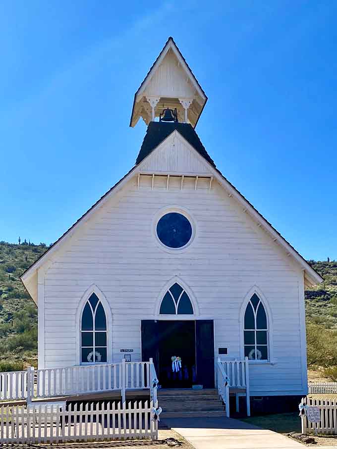 The Pioneer Community Church stands pristine in white, its simple architecture reflecting the spiritual foundation that anchored many frontier settlements.