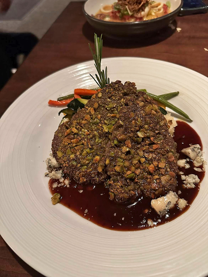 Vermont's forest meets culinary artistry &ndash; this nut-crusted venison with cherry reduction is what deer dream of becoming.