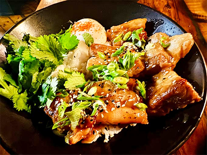 The legendary pork belly &ndash; crispy, caramelized exterior giving way to melt-in-your-mouth tenderness that might just bring tears of joy.