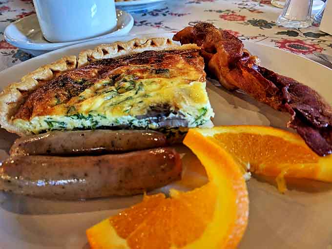 The complete French breakfast experience: quiche with crispy bacon and sausage links that would satisfy even the most discerning Francophile.