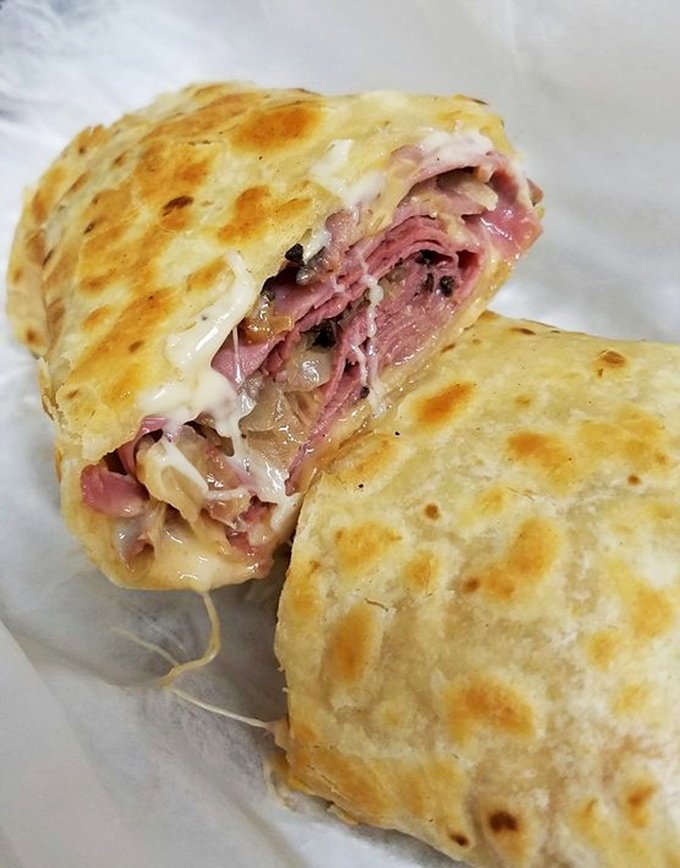 This  Reuben wrap isn't just holding ingredients &ndash; it's containing pure breakfast joy with eggs, cheese, and savory fillings.