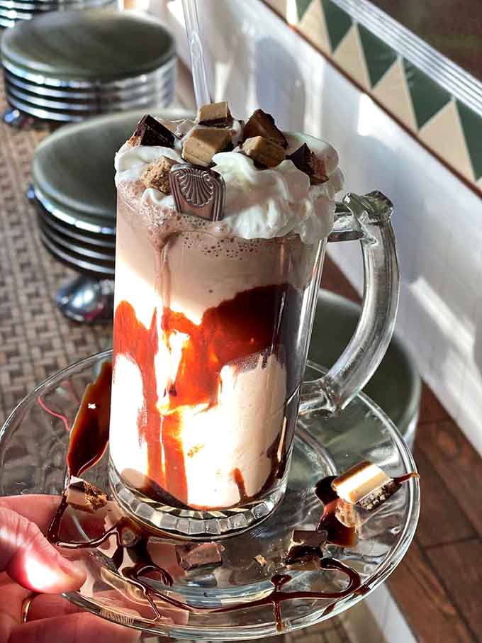 This boozy milkshake towers like a delicious skyscraper, complete with whipped cream, chocolate, and zero regrets about ordering it.