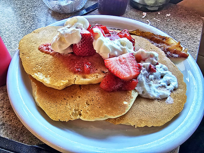 Pancakes shouldn't just be breakfast; they should be an event &ndash; these golden discs topped with fresh strawberries and whipped cream certainly qualify.