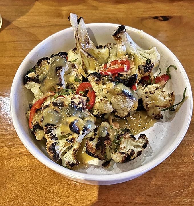 Roasted Cauliflower: Humble cauliflower transformed through fire and seasoning. Those charred edges tell stories of patience and perfect timing in the kitchen.