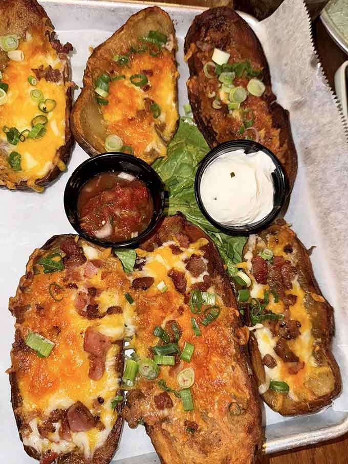 Loaded potato skins with all the fixings prove that even classic appetizers get the cowboy treatment here.