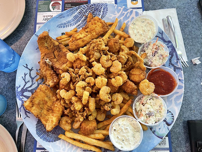 Seafood heaven on a plate &ndash; fried shrimp, scallops, haddock and more create a mountain of perfectly cooked treasures.