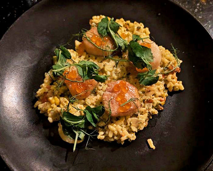 This isn't just risotto &ndash; it's a seafood sonnet. Perfectly seared scallops nestled on creamy grains with seasonal accompaniments that sing.