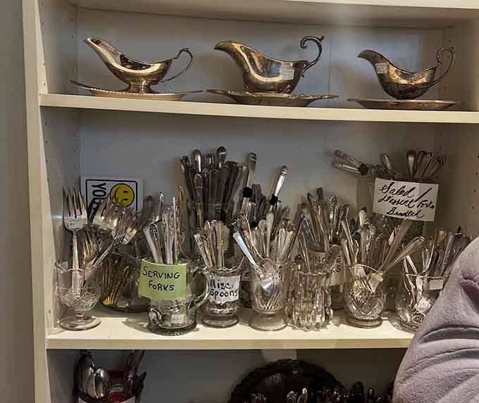 Silver-plated flatware fills containers like metallic bouquets, each piece adding weight and elegance to any table setting you can imagine.