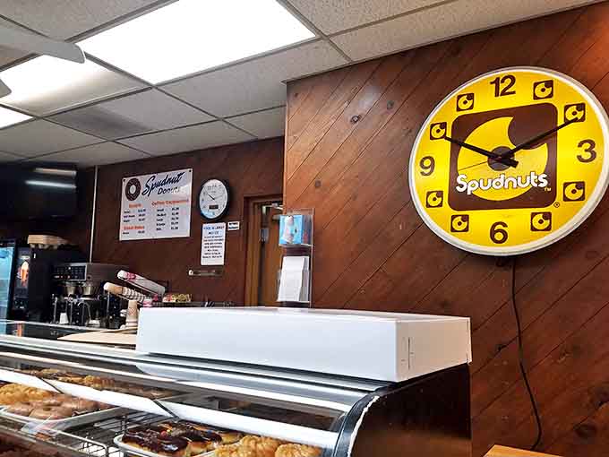 Shop Counter: The Spudnuts clock reminds customers it's always time for a donut in this wood-paneled paradise.
