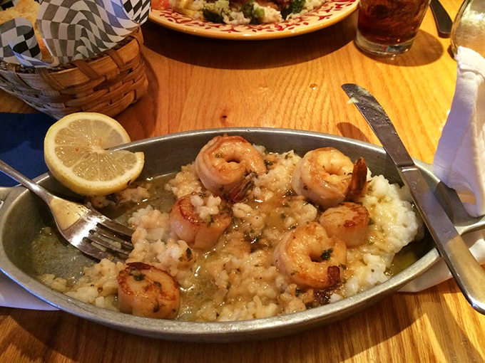 Perfectly seared shrimp rest atop a bed of risotto &ndash; a marriage of Italian technique and fresh New England ingredients.