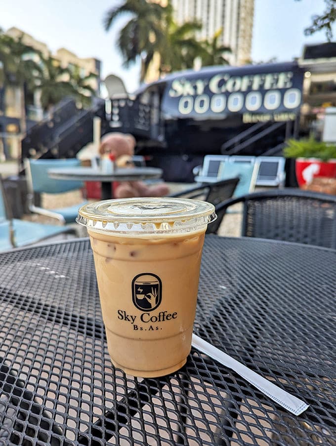 Their signature iced coffee provides the perfect cooling altitude in Miami's heat, served in a cup that proudly displays the Sky Coffee logo.