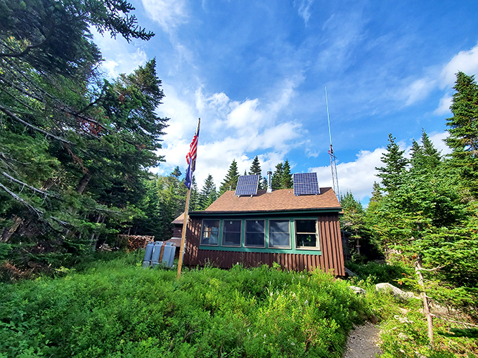 Backcountry luxury: The rustic ranger cabin stands sentinel at Chimney Pond, solar panels providing just enough modern convenience.