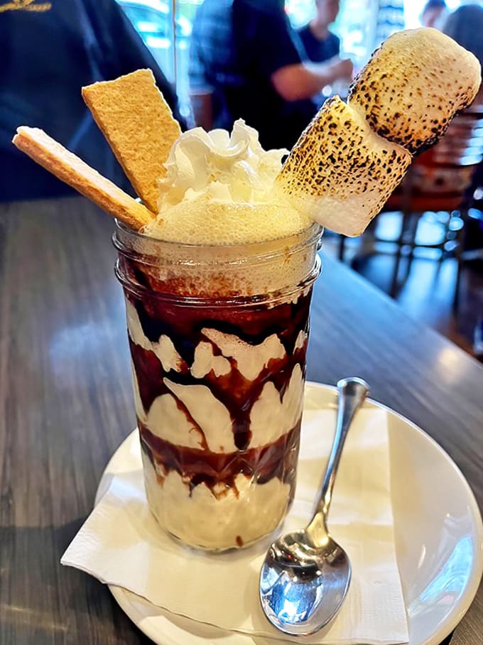 The S'mores Milkshake &ndash; where campfire memories meet milkshake dreams in a towering creation that demands to be photographed before devoured.