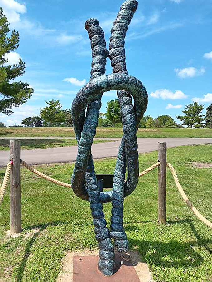From this angle, the knot seems to dance against blue skies, proving art can tie together nature and sculpture.